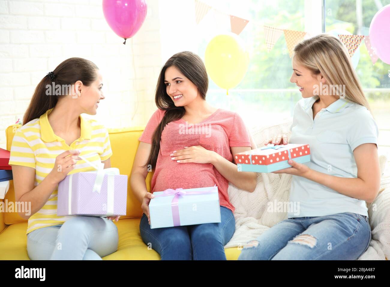 Woman hold friends baby hi-res stock photography and images - Alamy