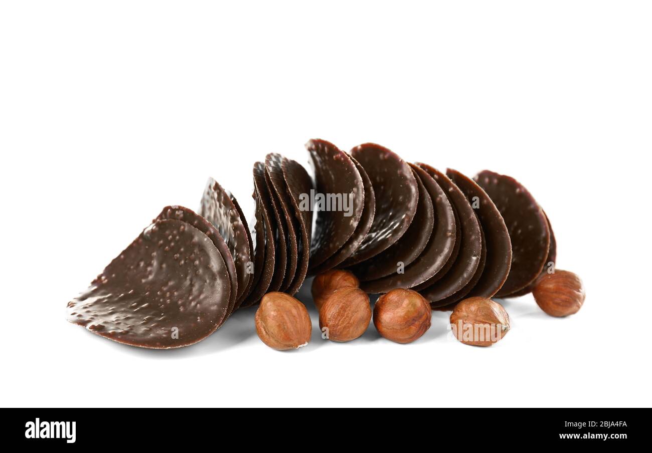 Chocolate chips and hazelnuts on white background Stock Photo - Alamy