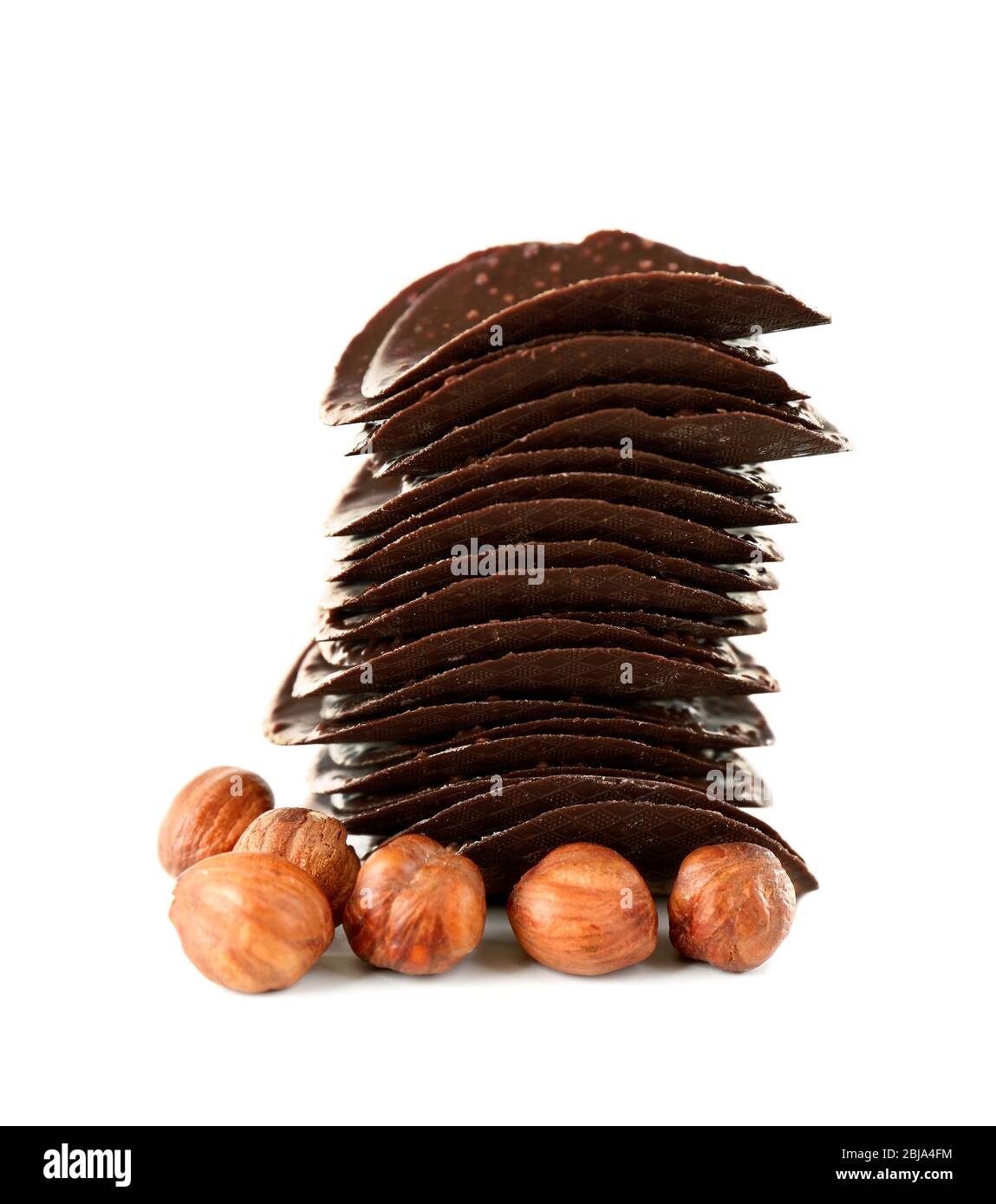 Chocolate chips and hazelnuts on white background Stock Photo - Alamy