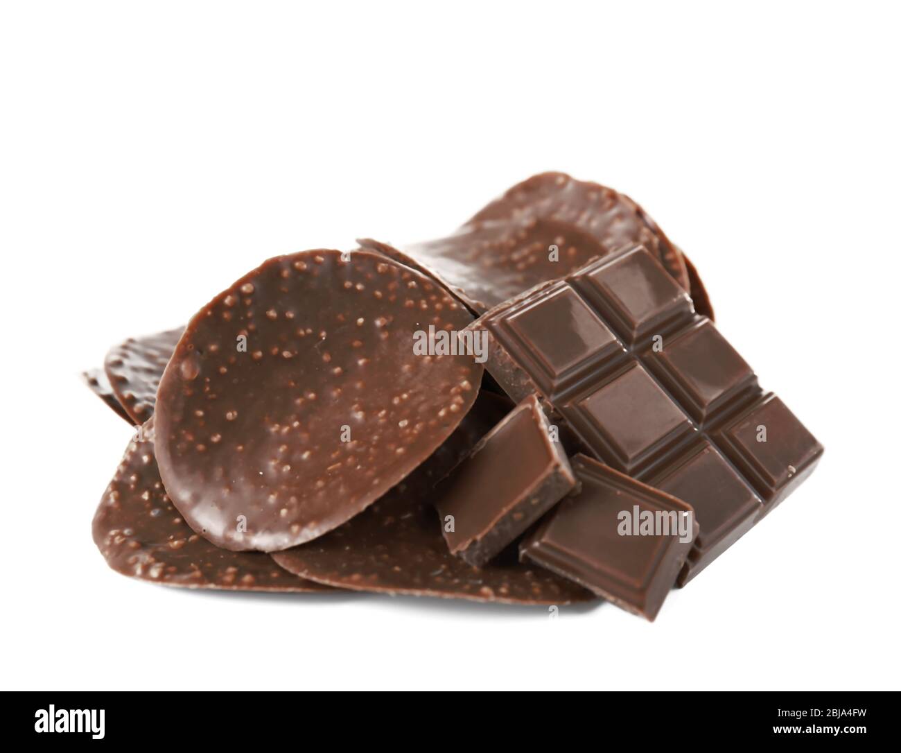 Chocolate chips and pieces on white background Stock Photo - Alamy
