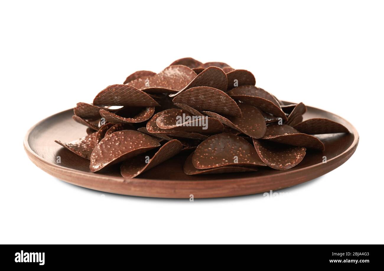 Chocolate chips in brown plate on white background Stock Photo - Alamy