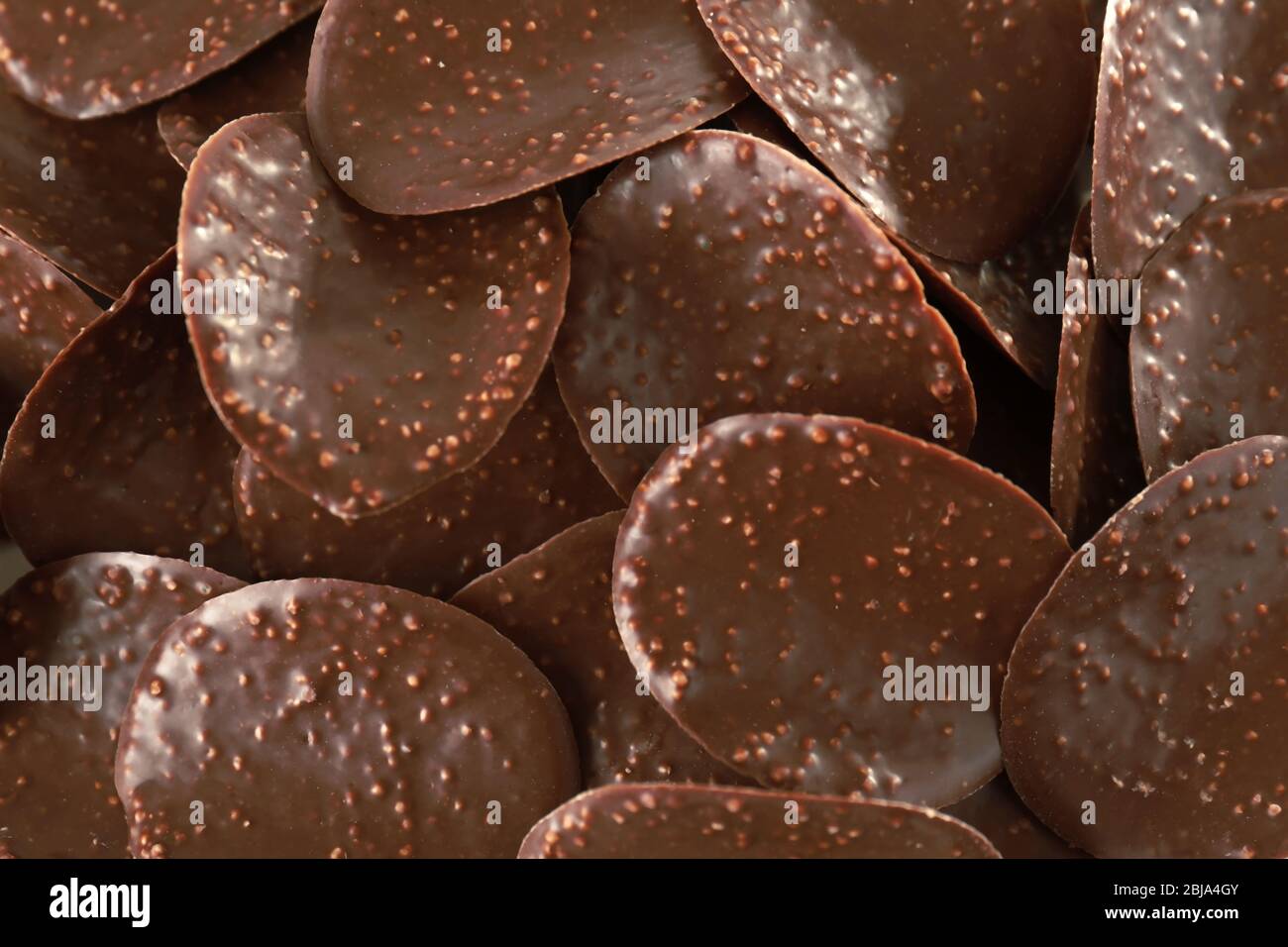 Chocolate chips background Stock Photo - Alamy