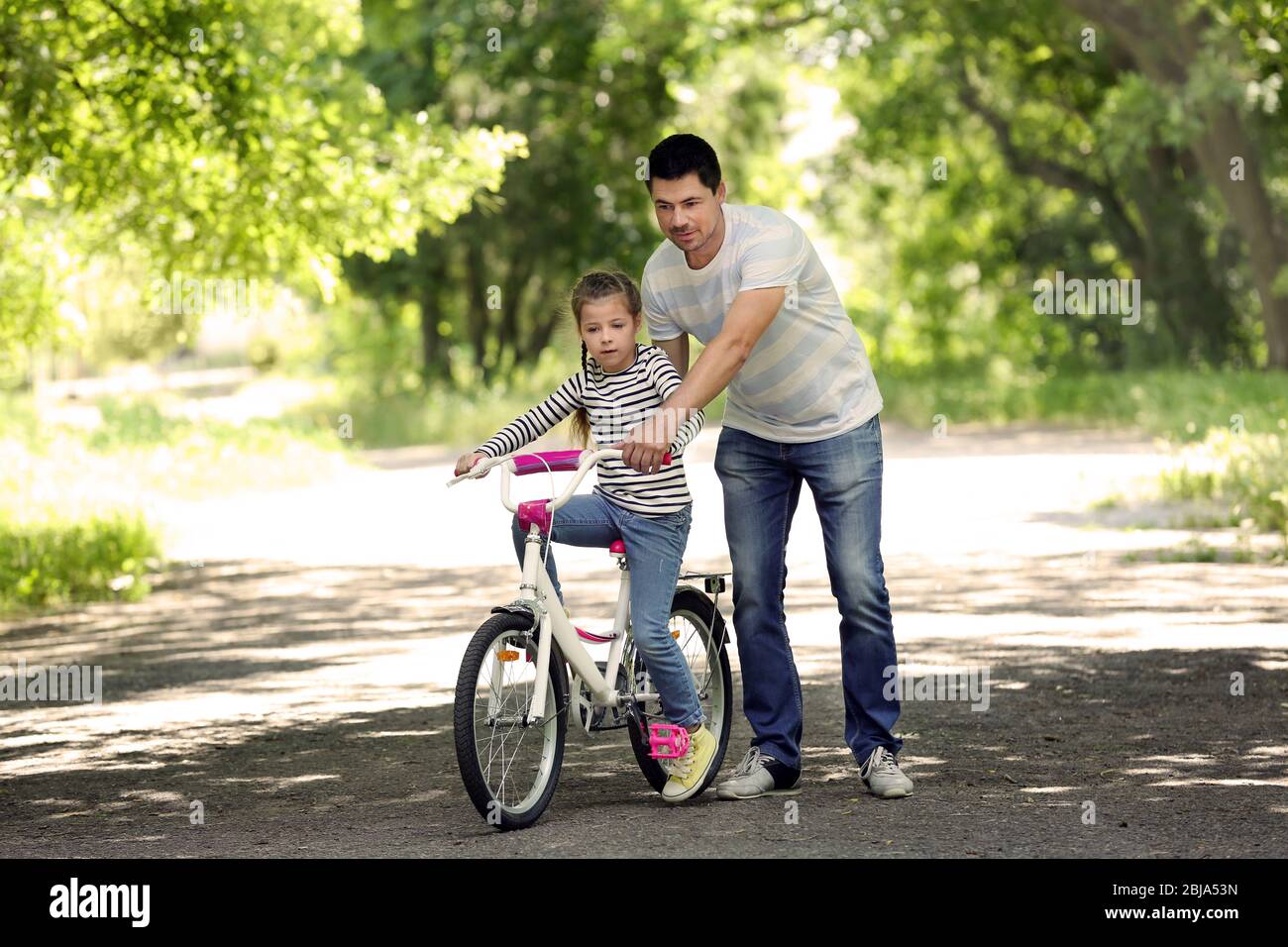 Teaching to ride bike hi-res stock photography and images - Alamy