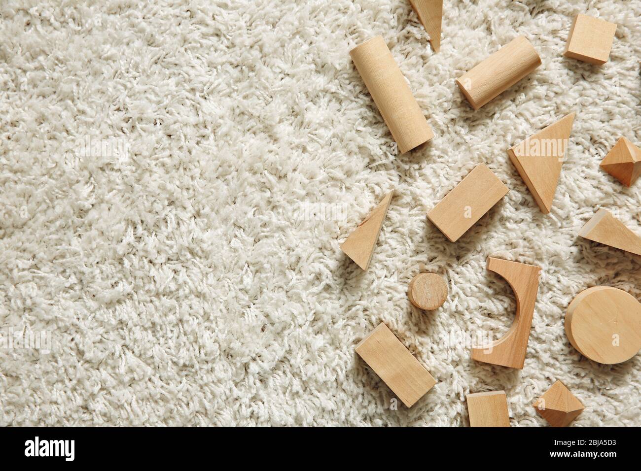 Set of wooden kids building blocks, top view Stock Photo - Alamy