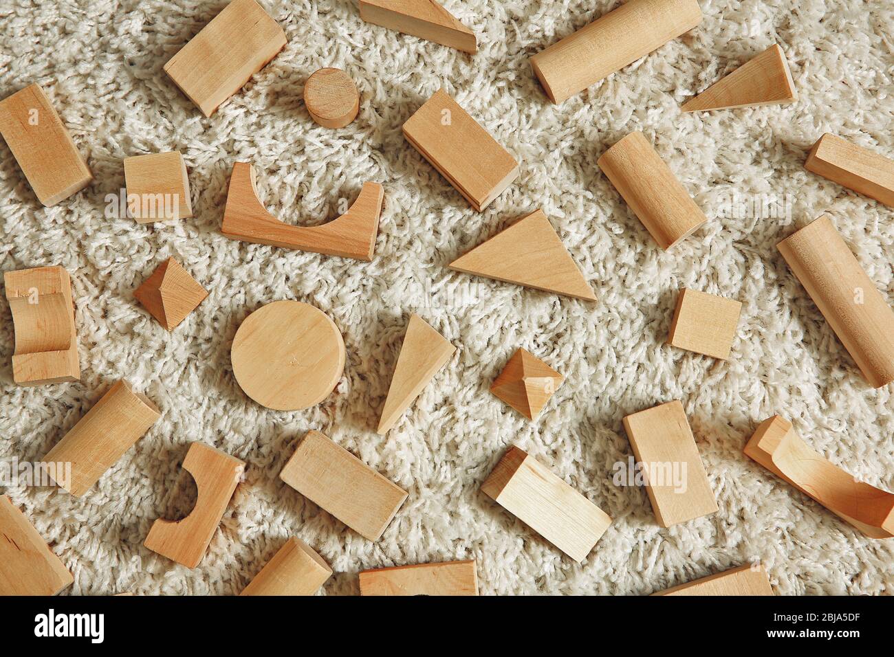 Set of wooden kids building blocks, top view Stock Photo - Alamy