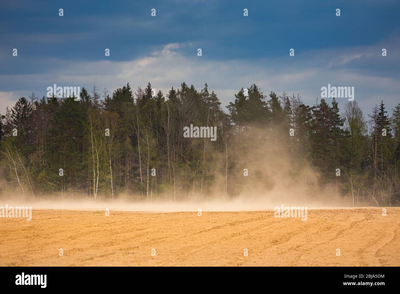 Dust storm in dry fields, dry weather infuenced by climate change Stock ...