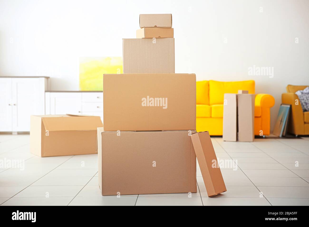 House move concept. Carton boxes in the room Stock Photo - Alamy
