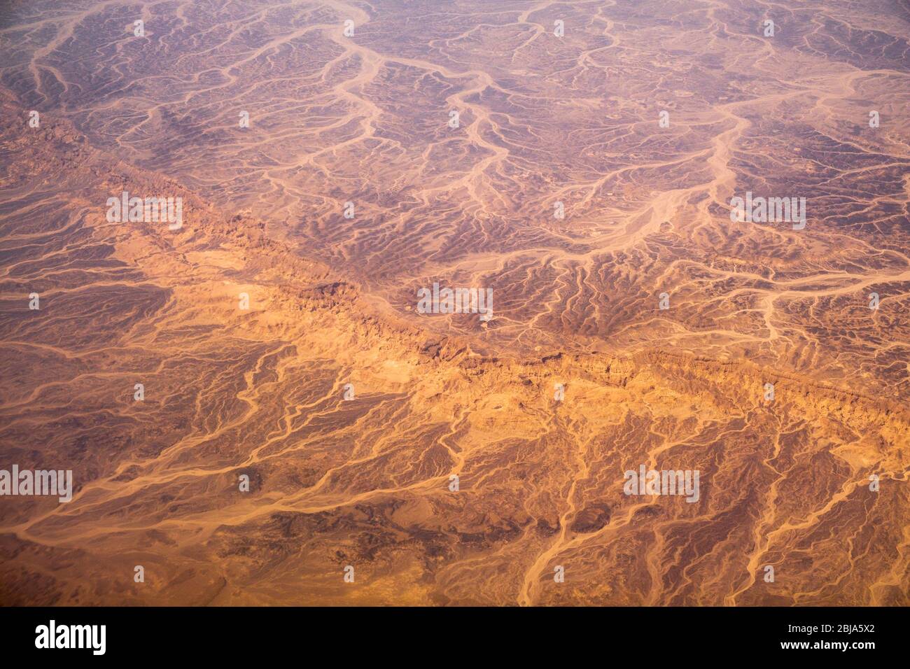Aerial airplane view of barren Sahara desert landscape in Egypt with ...