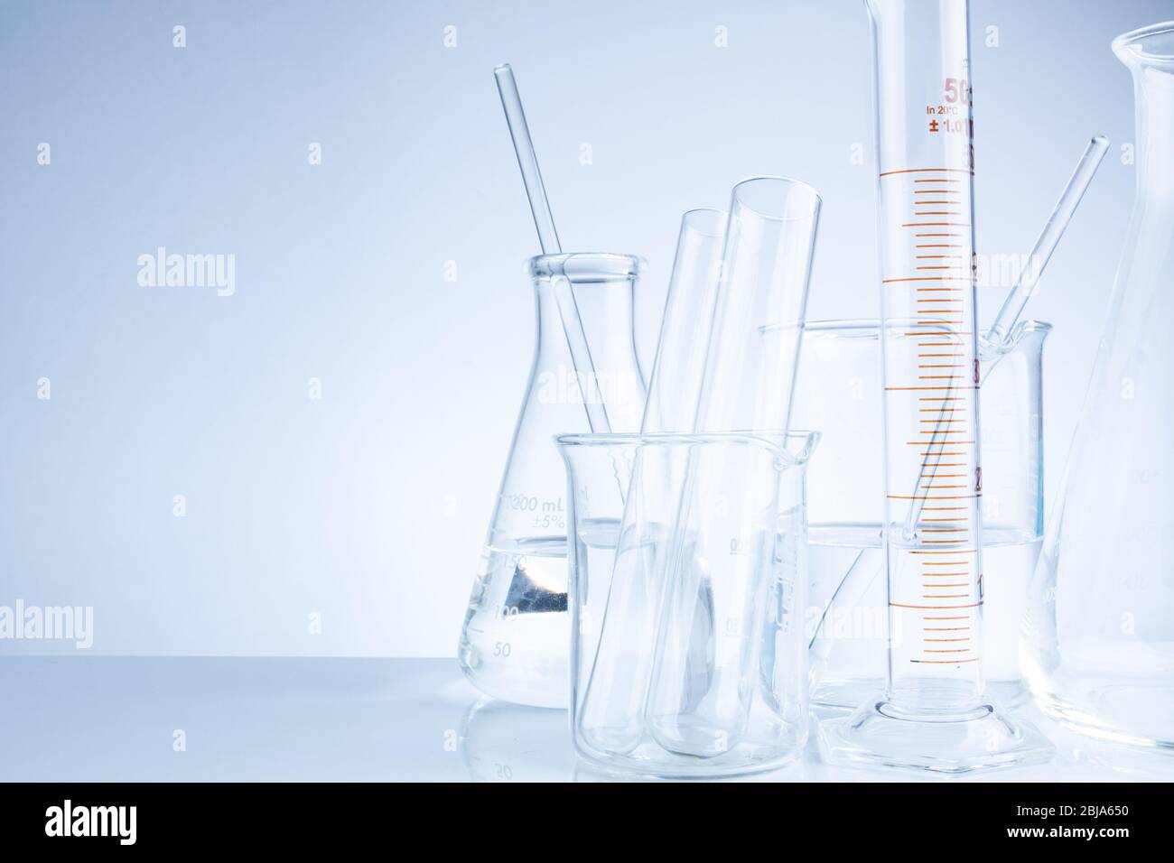 Group of laboratory glassware on table, Symbolic of science research ...
