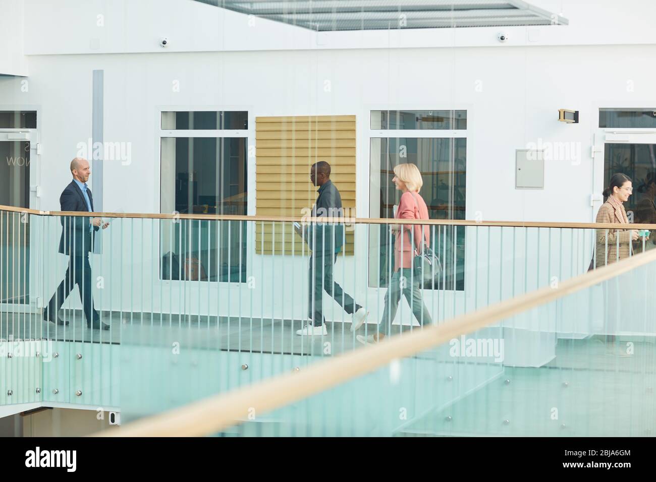 Businessman walking along office hi-res stock photography and images ...