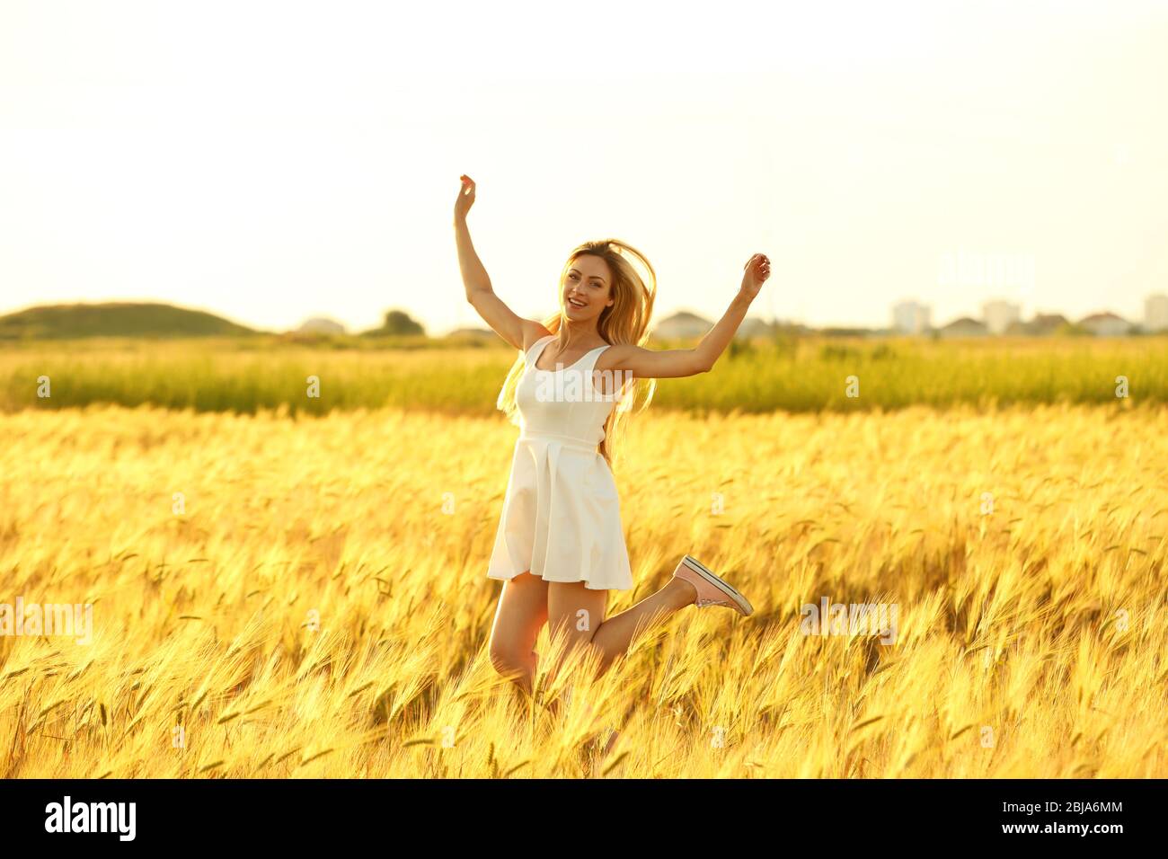 Wheat field woman jump hi-res stock photography and images - Alamy