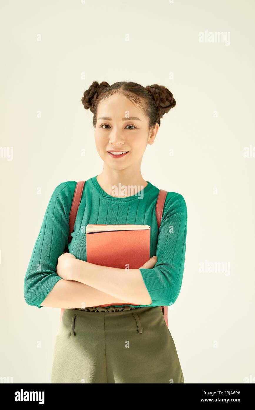 Beautiful relaxed young student girl with exercise books Stock Photo ...