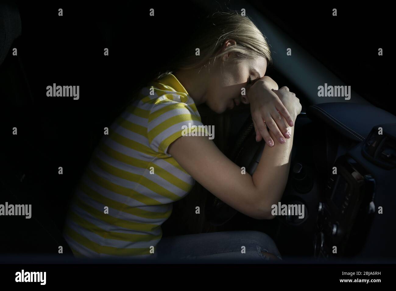 Tired beautiful woman falling asleep in car Stock Photo - Alamy