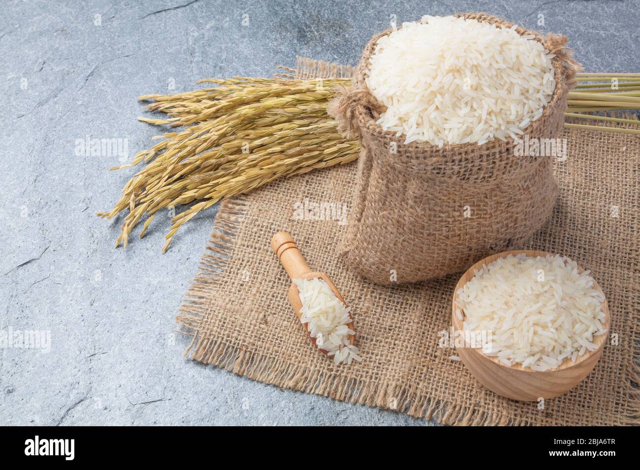 thai fragrant jasmine rice in a bowl with gold spike on Sack Stock ...