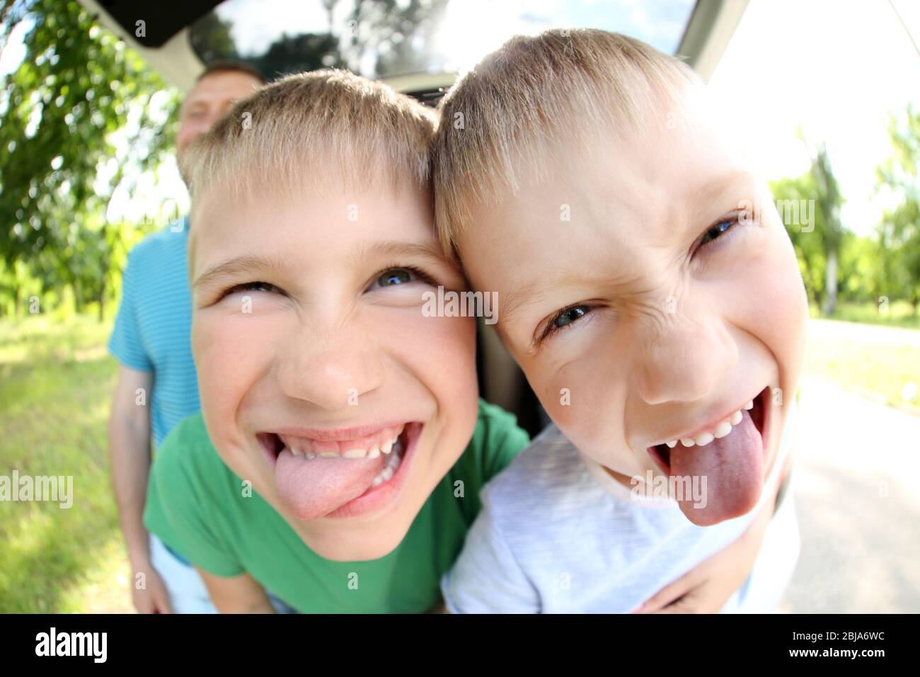 Funny boys looking into camera Stock Photo - Alamy