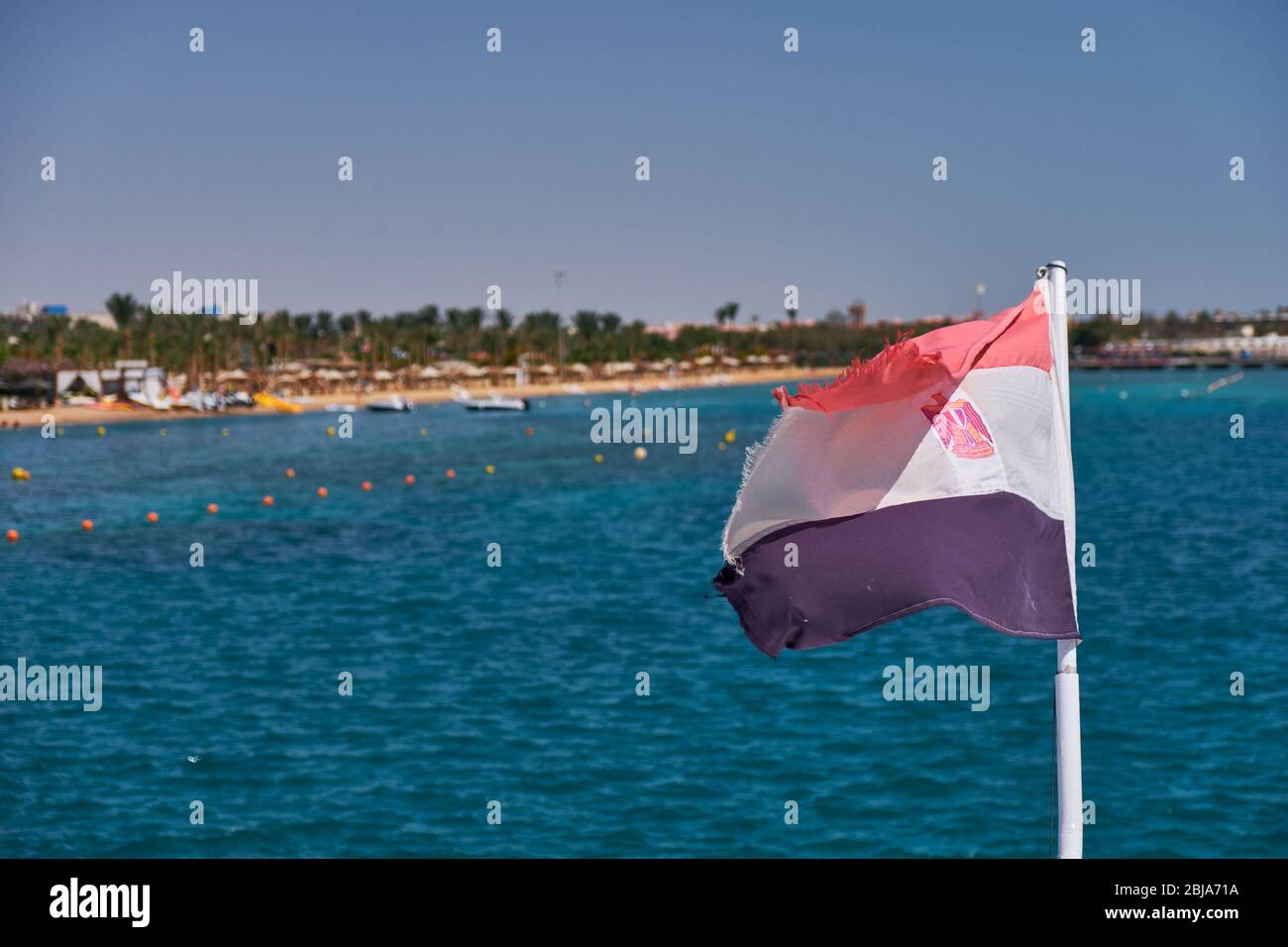 Egyptian flag flying in the wind, placed at the stern of the boat, with ...
