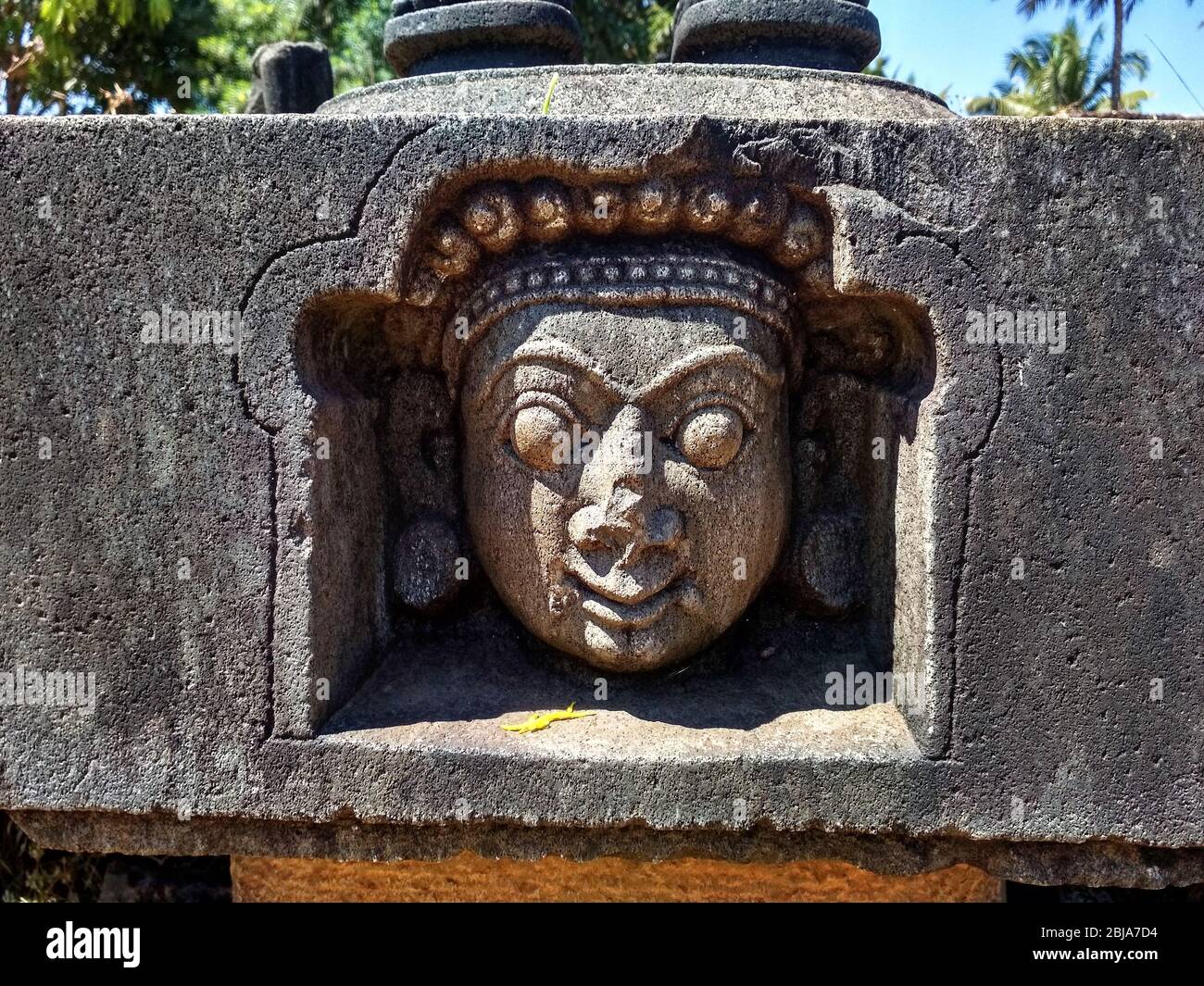 Man face carved in niche at Aghoreshwara temple Stock Photo - Alamy