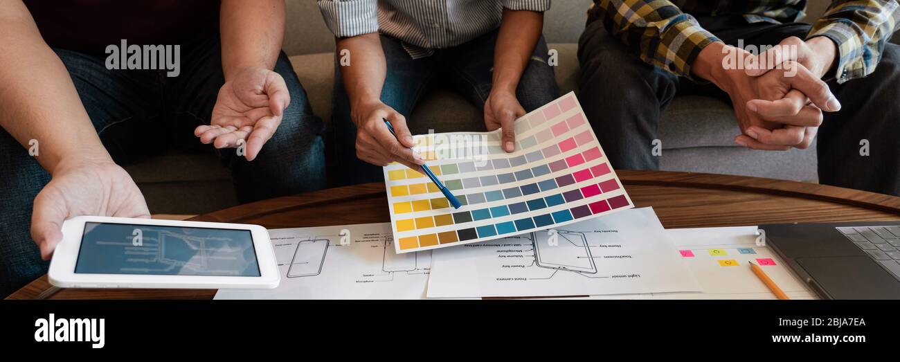Creative team analyzing prototype products for product design in ...