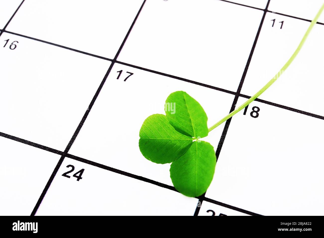 Clover leaf on calendar background Stock Photo - Alamy