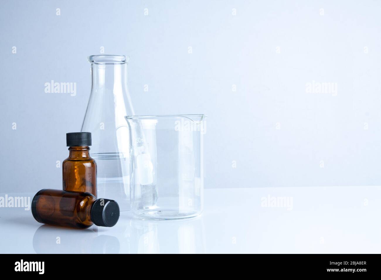 Group of laboratory glassware on table, Symbolic of science research ...