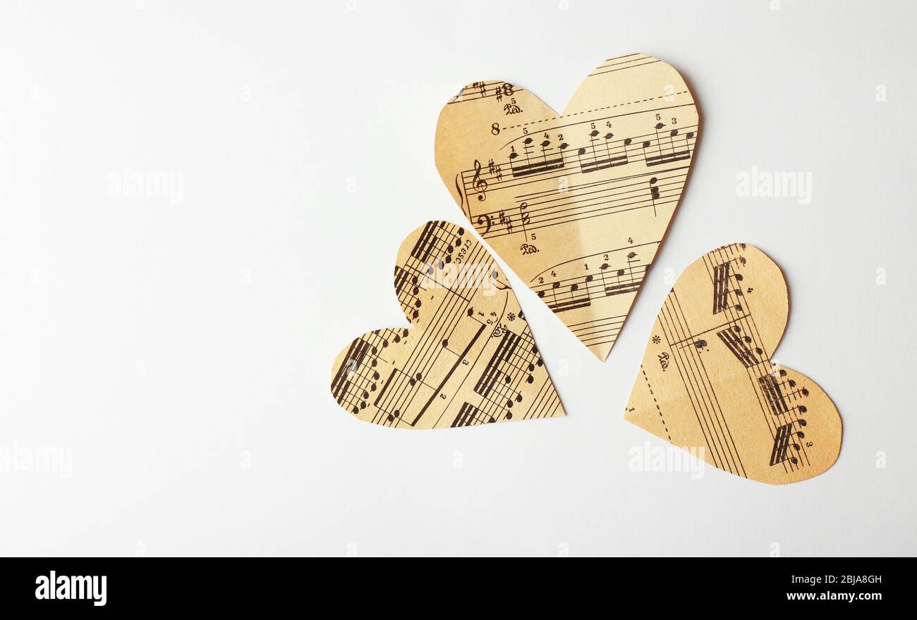 Paper hearts with notes on white background, music concept Stock Photo ...