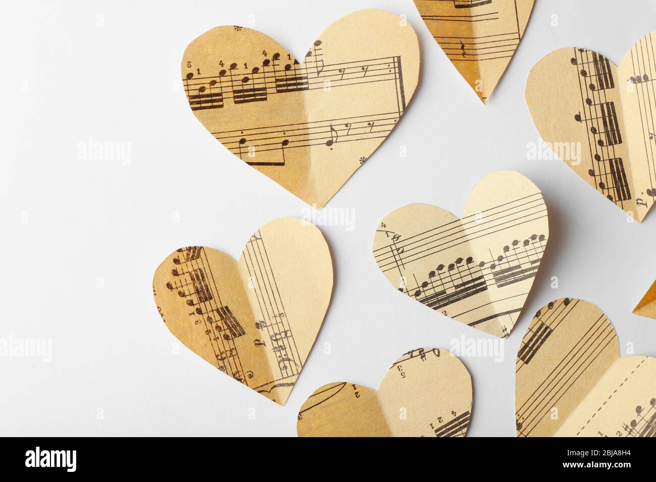 Paper hearts with notes on white background, music concept Stock Photo ...