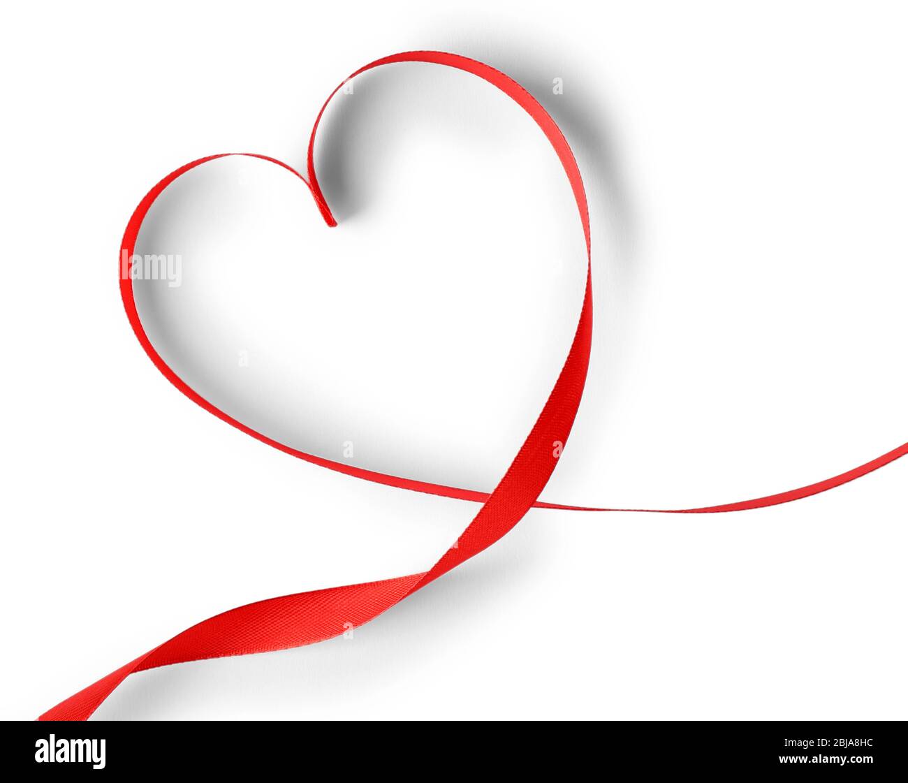 Red ribbon in shape of heart isolated on white Stock Photo - Alamy