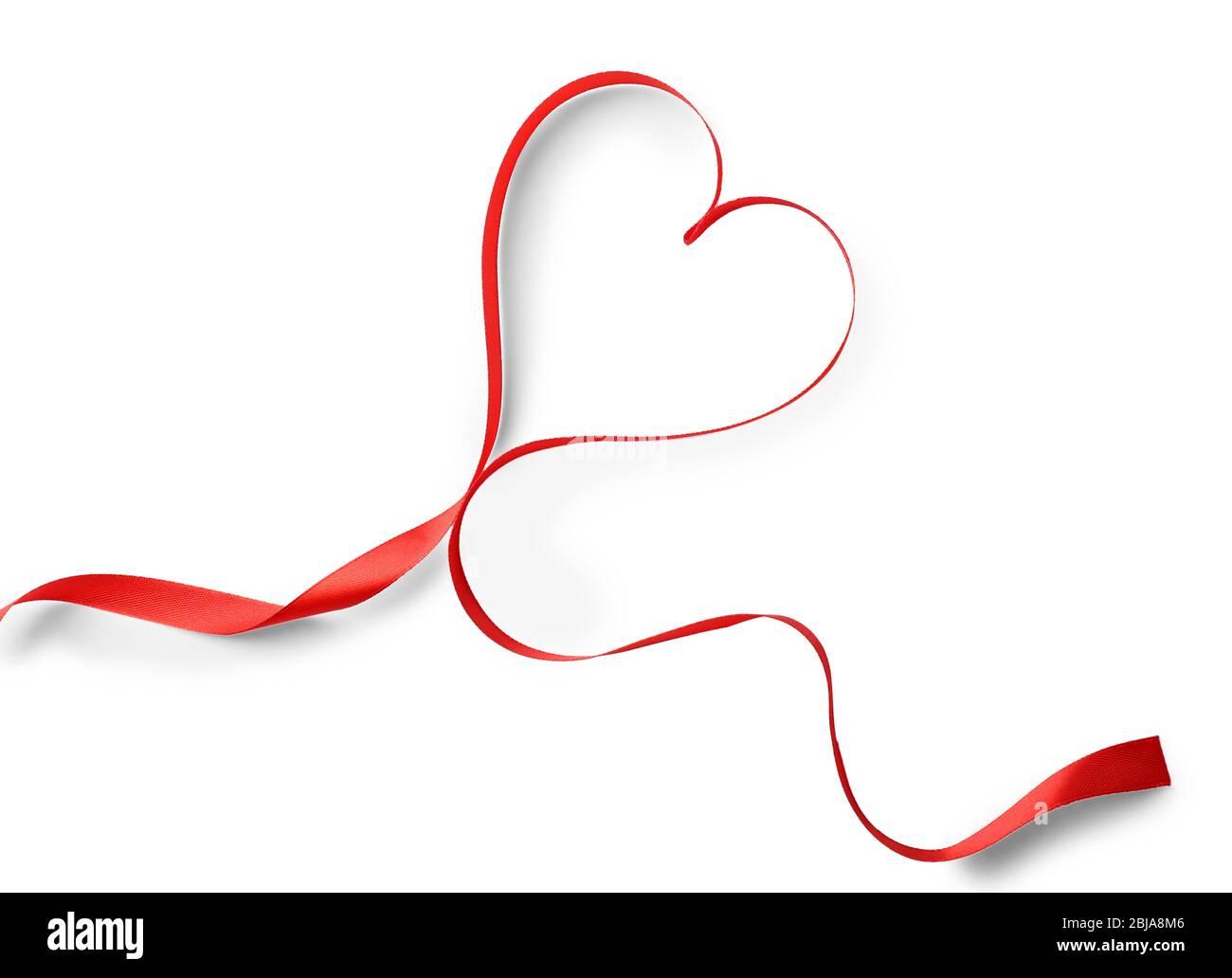 Red ribbon in shape of heart isolated on white Stock Photo - Alamy