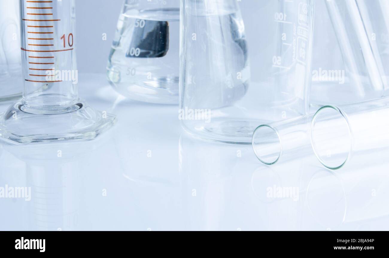 Group of laboratory glassware on table, Symbolic of science research ...