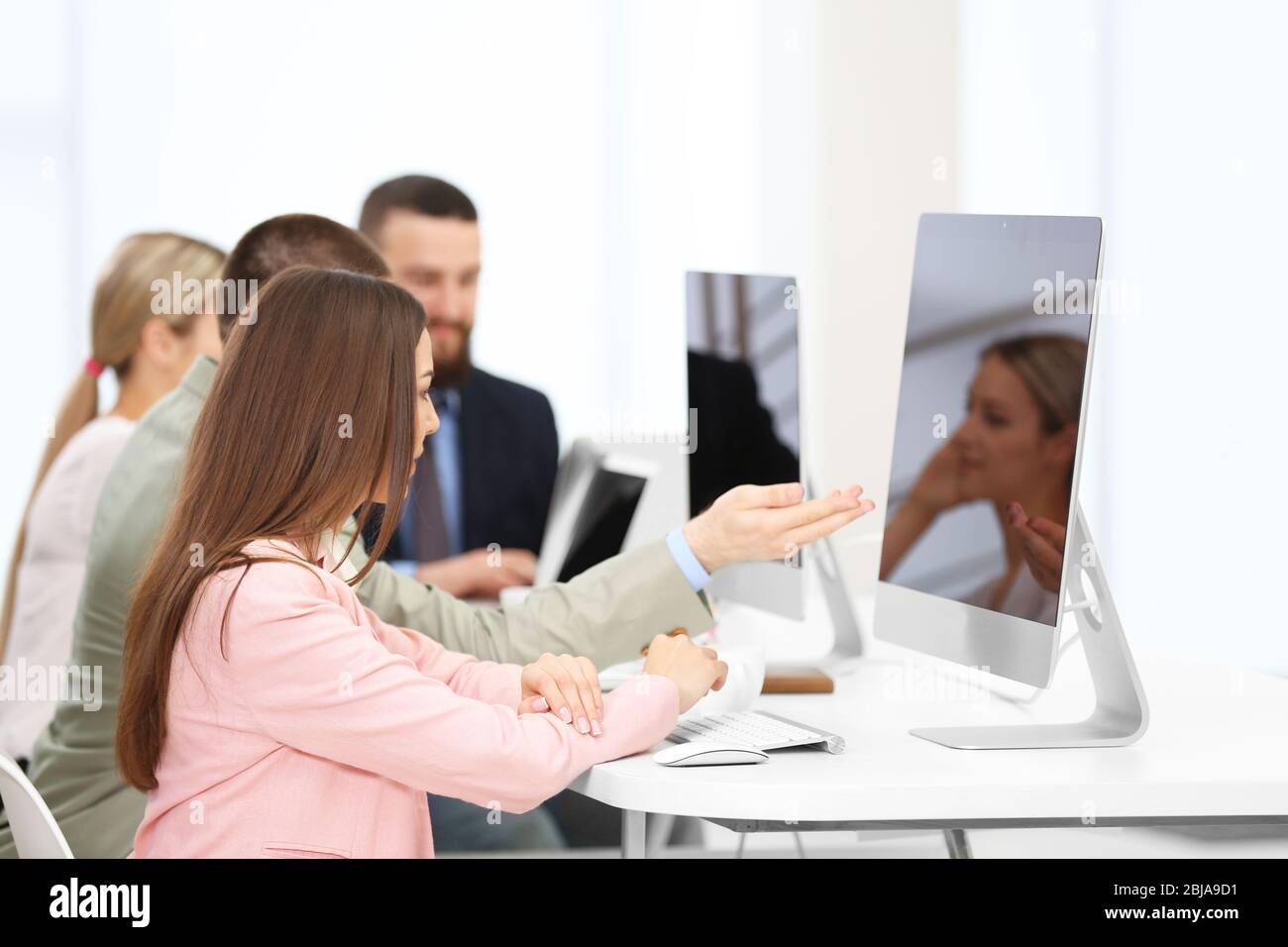 People working on computers at a office Stock Photo - Alamy