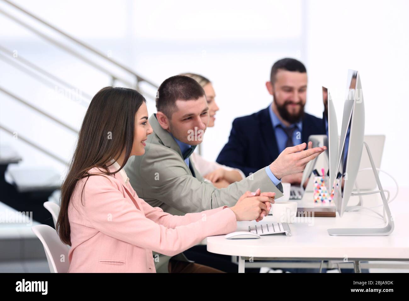 People working on computers at a office Stock Photo - Alamy