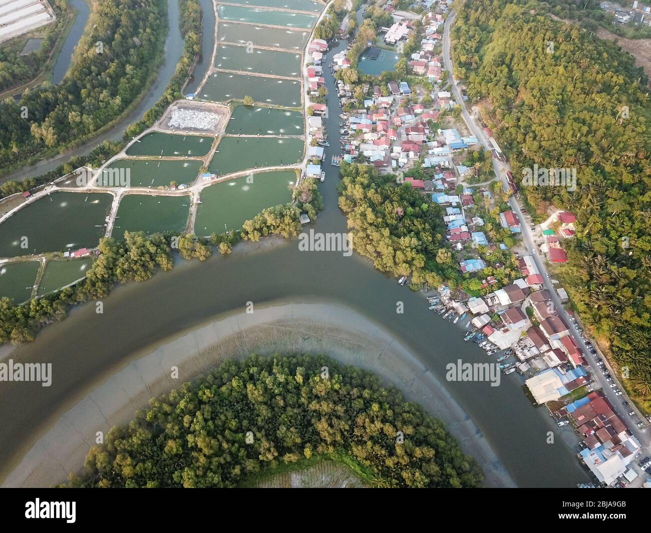 Aerial view fishing village and fish farm beside river Stock Photo - Alamy