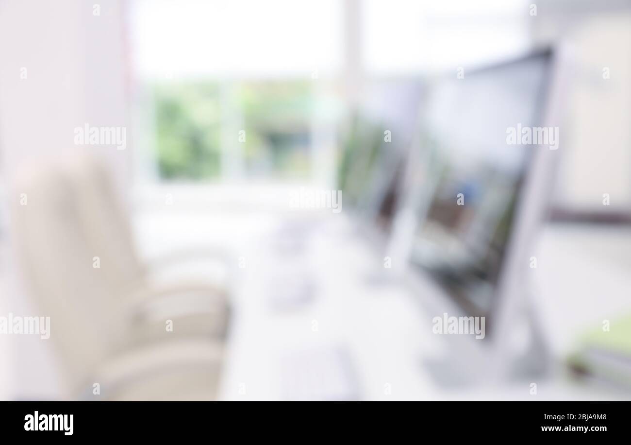 Blurred office background with computers Stock Photo - Alamy