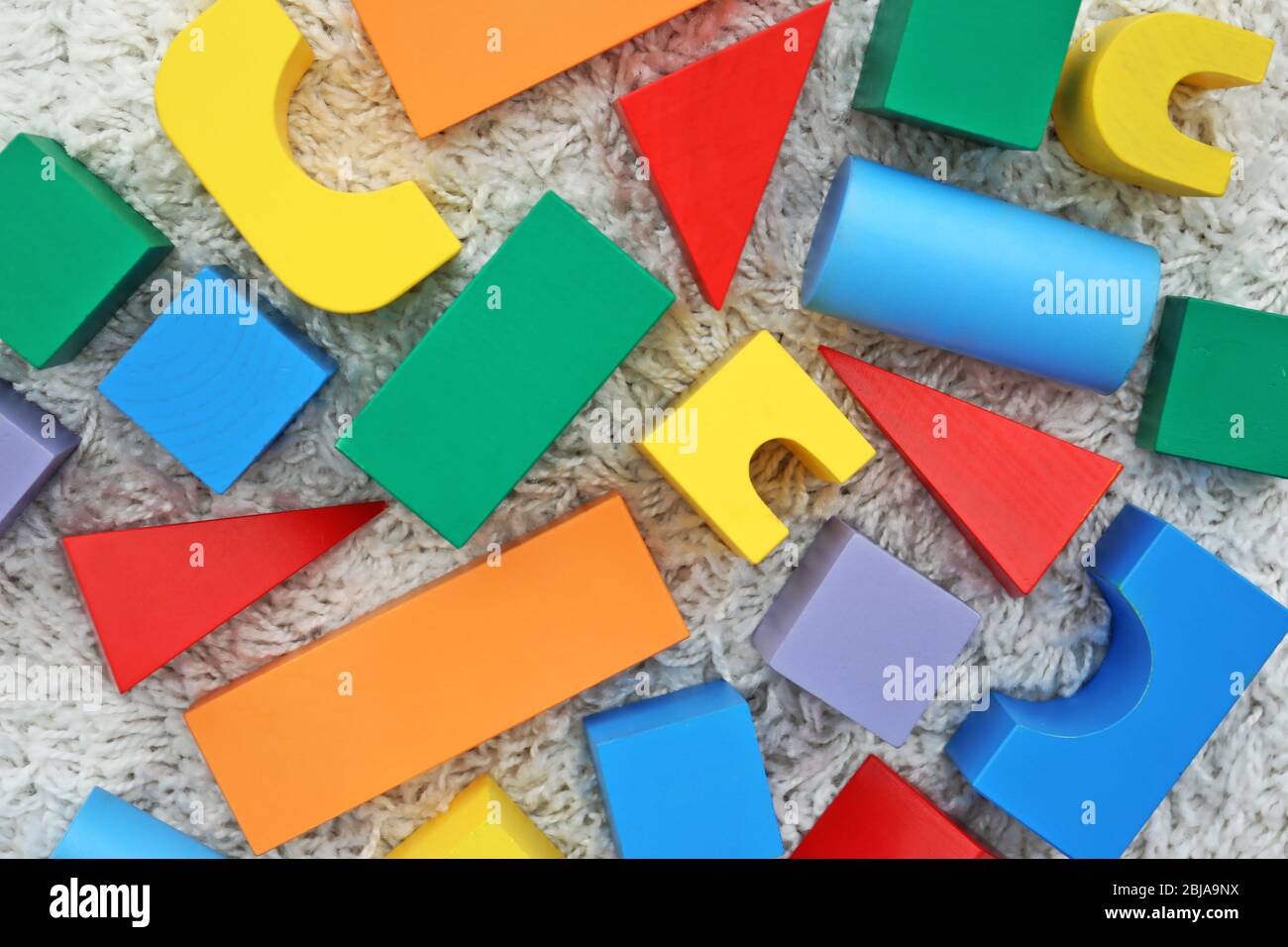 Colorful wooden children's building blocks background Stock Photo - Alamy