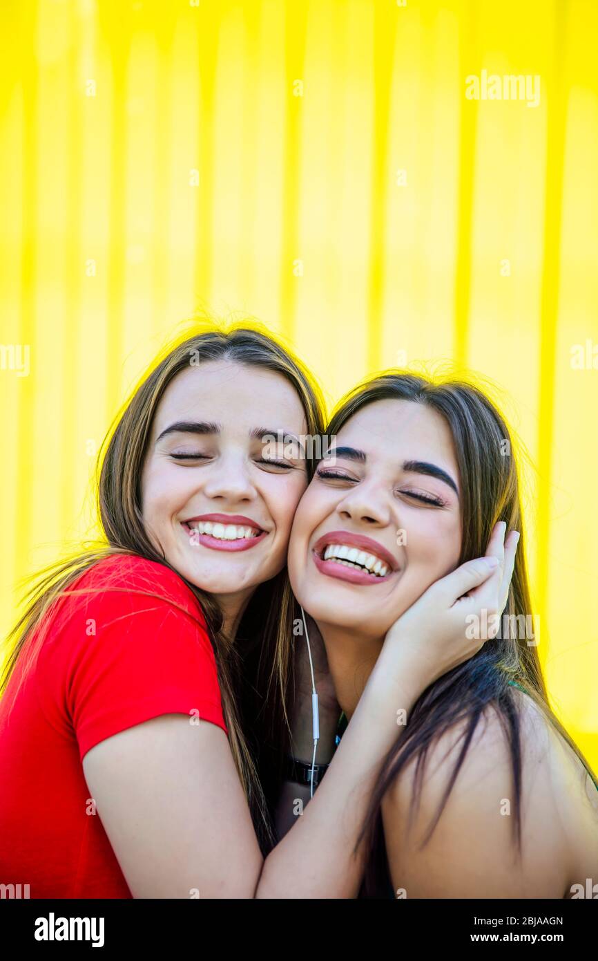 Two best female friends embracing together outdoors Stock Photo - Alamy
