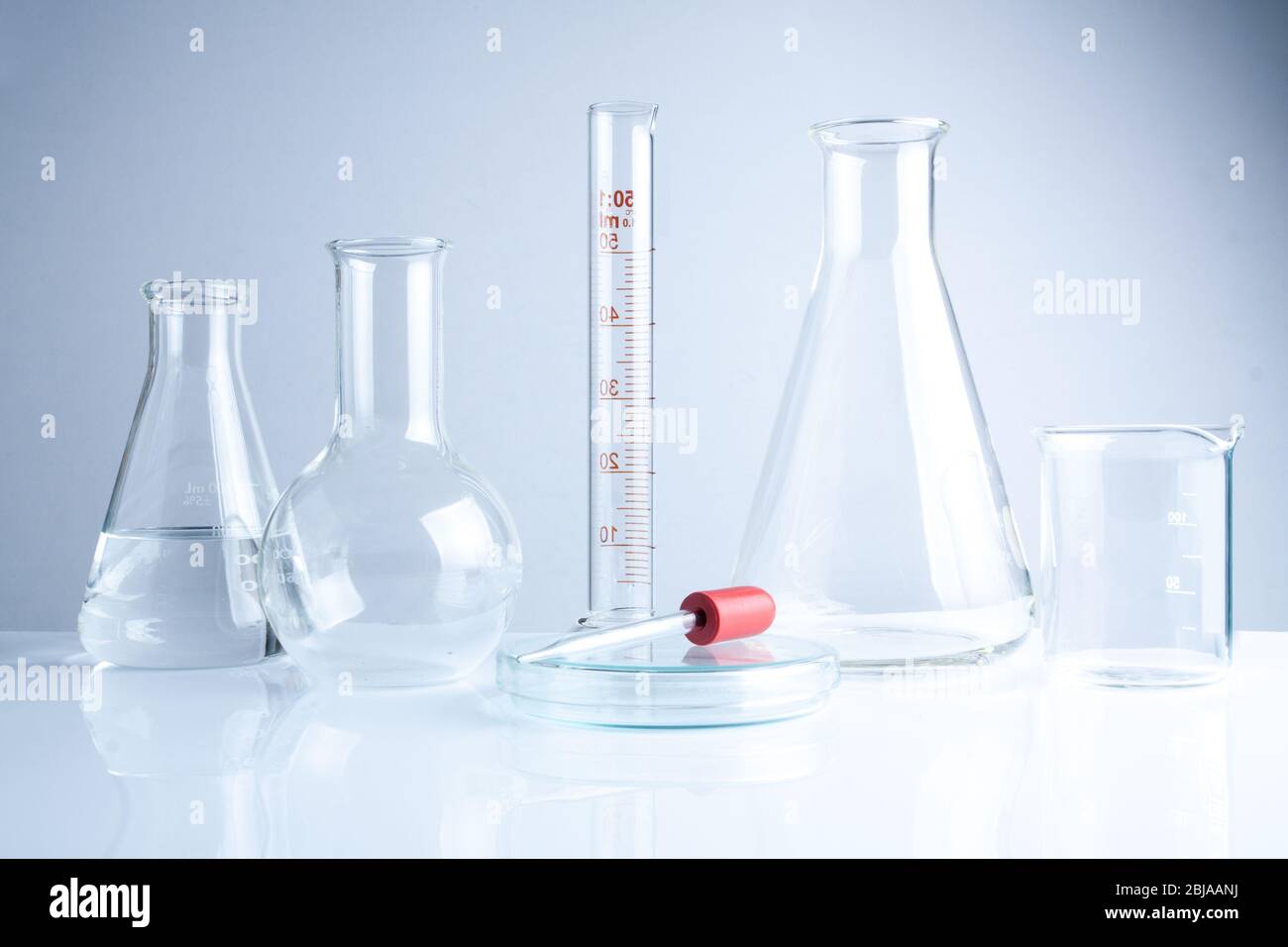 Group of laboratory glassware on table, Symbolic of science research ...