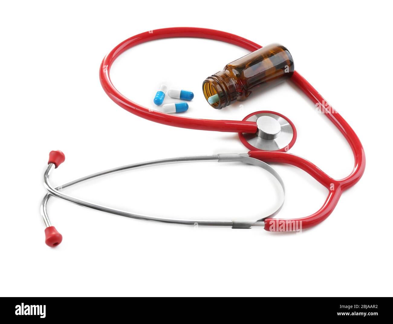 Stethoscope with colourful pills isolated on white Stock Photo - Alamy