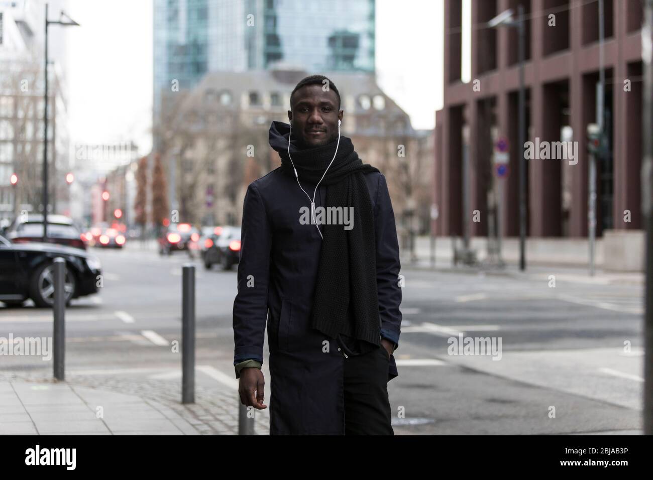 Handsome black man standing hi-res stock photography and images - Alamy