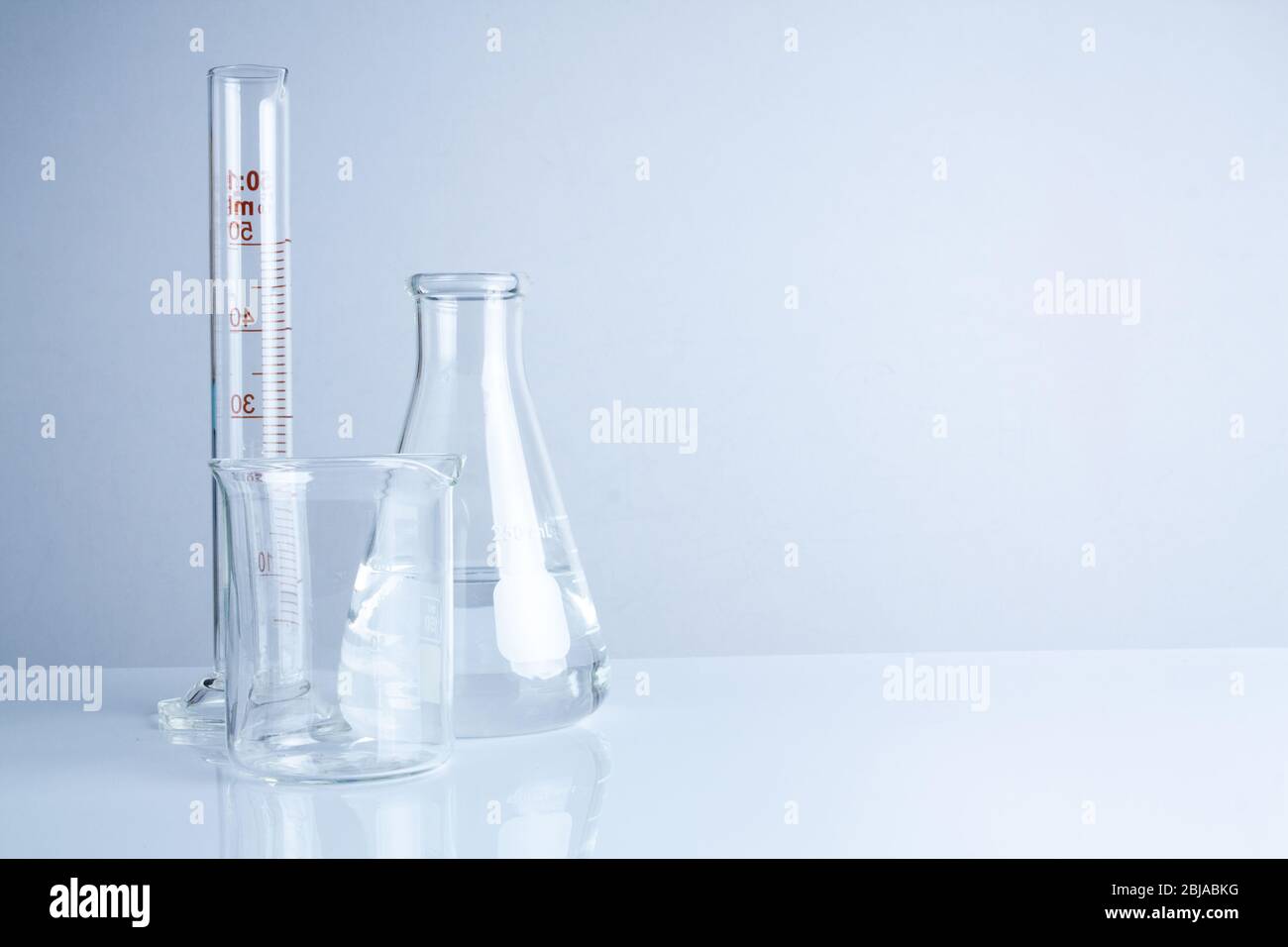Group of laboratory glassware on table, Symbolic of science research ...