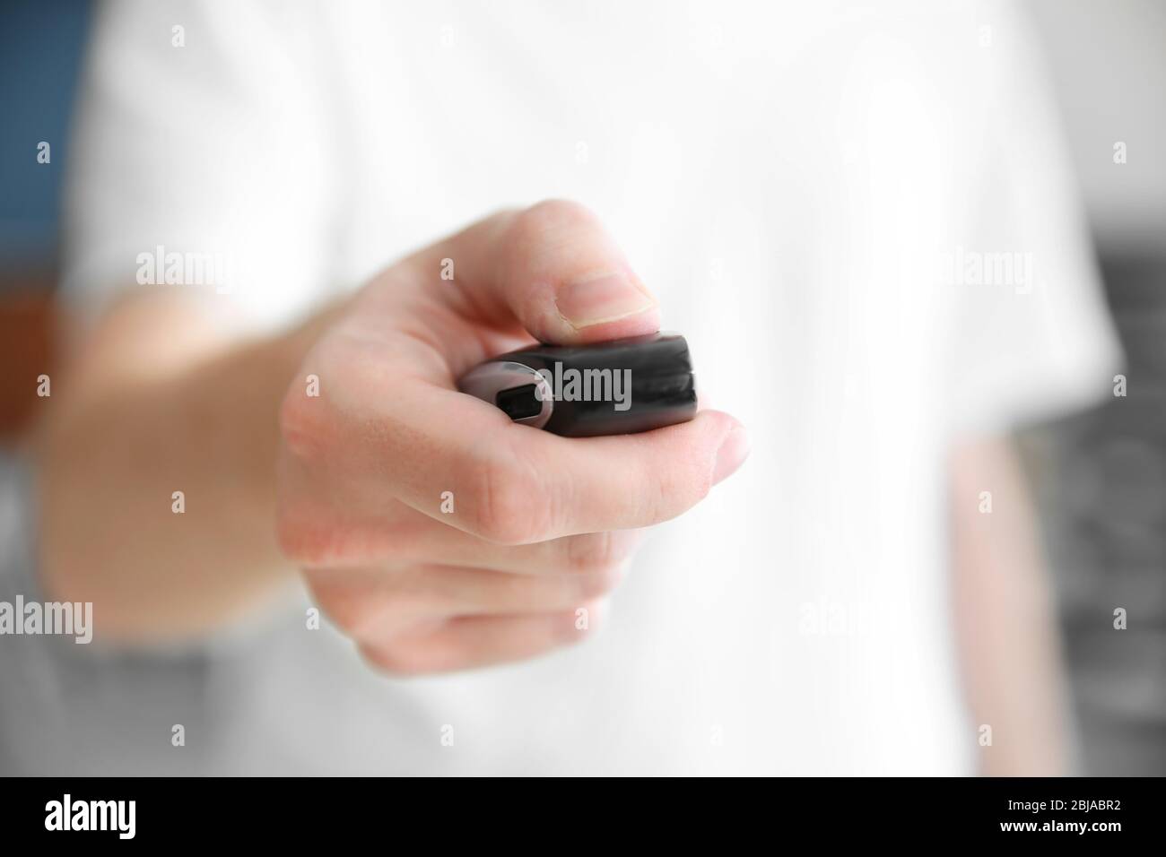 Hand pressing remote hi-res stock photography and images - Alamy