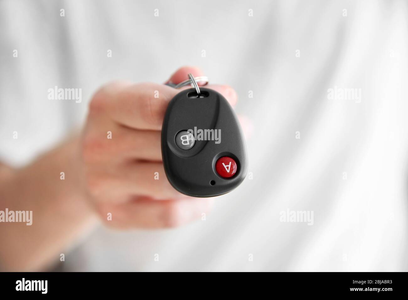 Man hand holding remote control hi-res stock photography and images - Alamy
