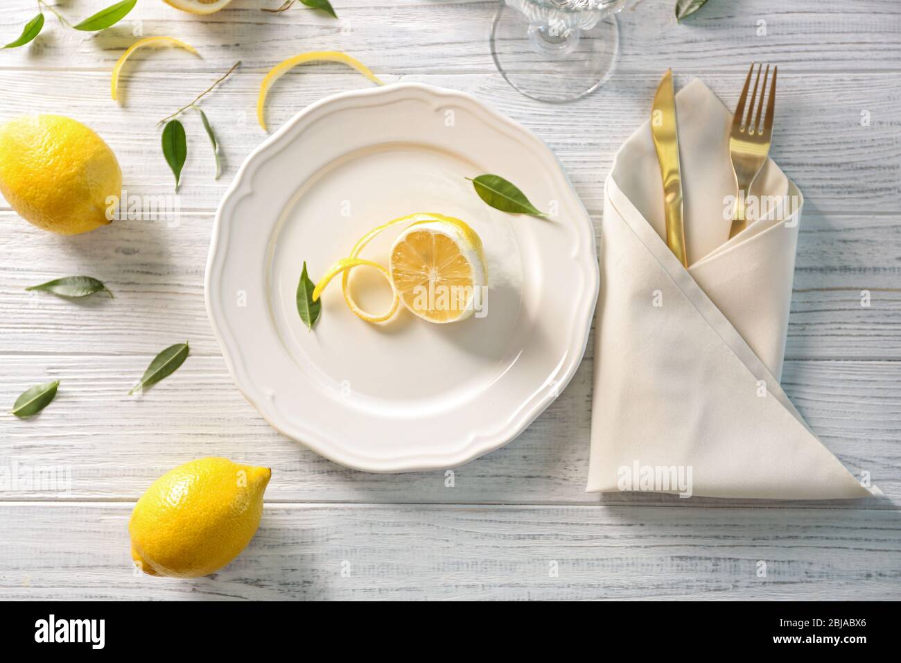 Beautiful table setting on wooden background Stock Photo - Alamy