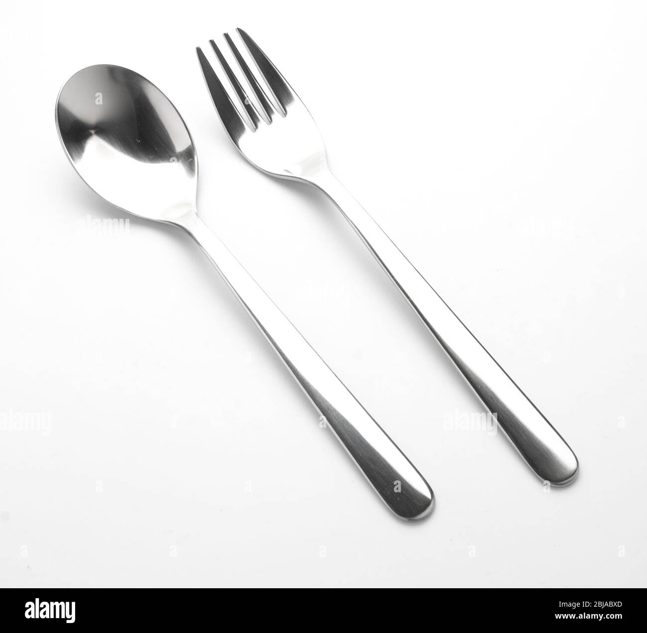 fork and spoon on white background Stock Photo - Alamy