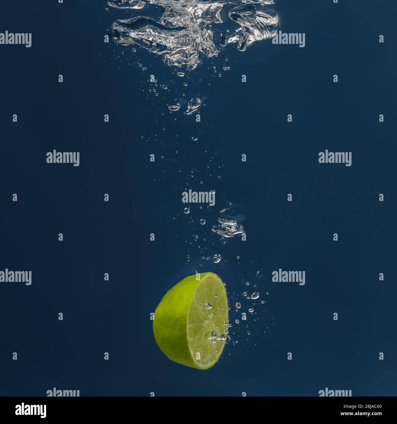 Sliced lime lemon falling water hi-res stock photography and images - Alamy