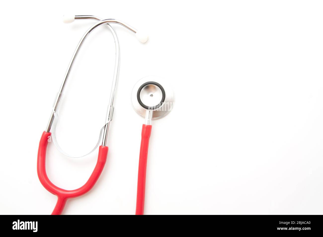 Close -up red stethoscope on white background Stock Photo - Alamy