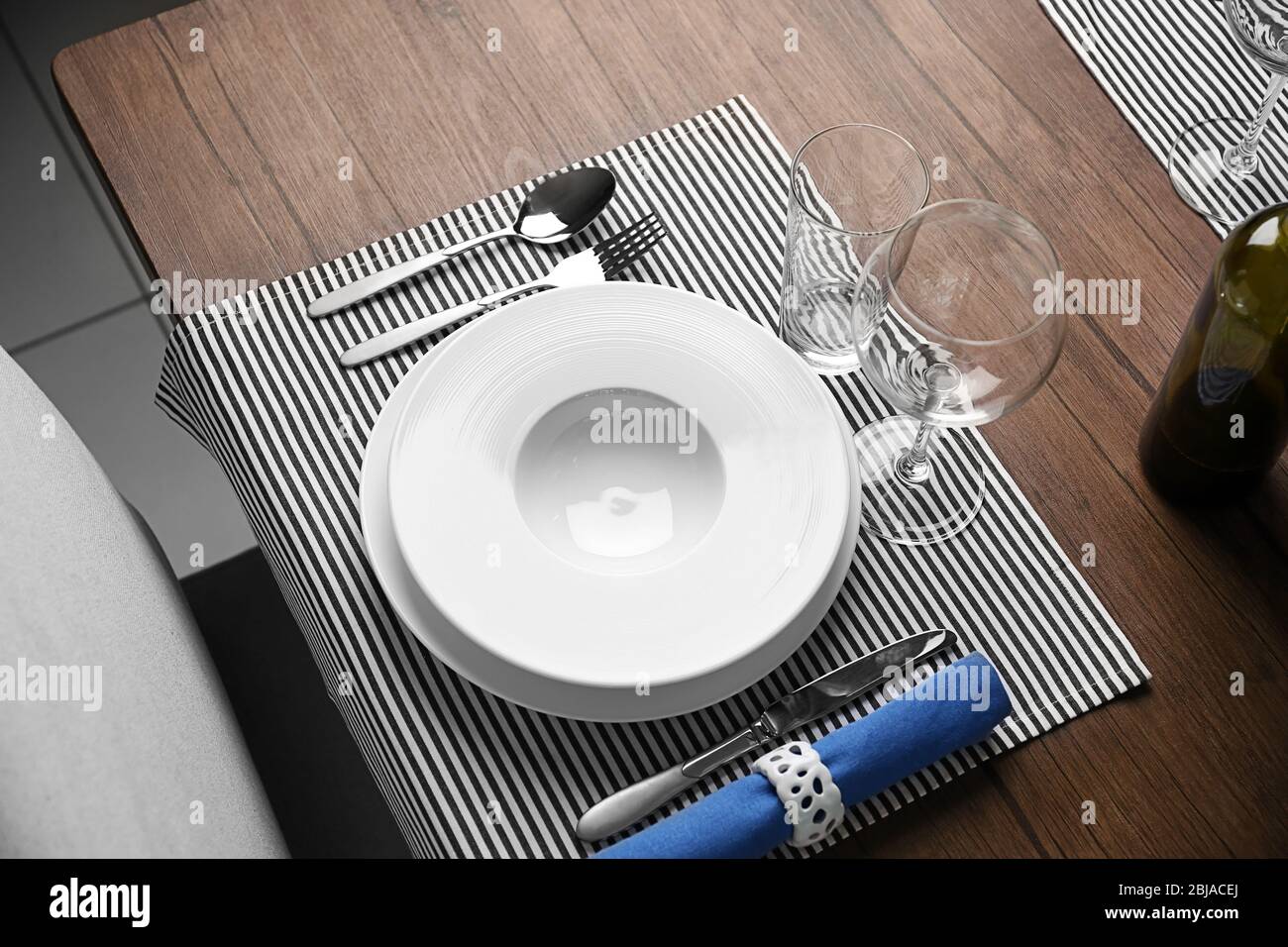 Elegant table appointments with blue napkin Stock Photo - Alamy