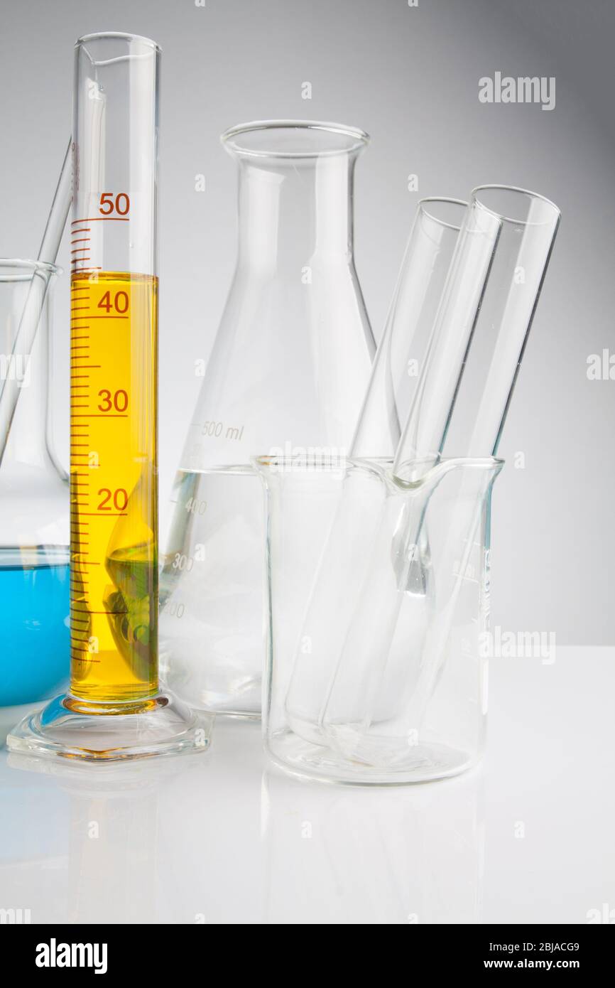 Group of laboratory glassware on table, Symbolic of science research ...