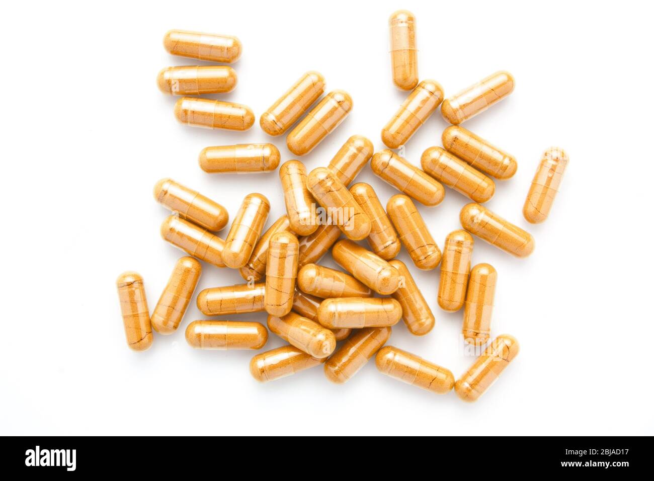 herb capsule on white background Stock Photo - Alamy