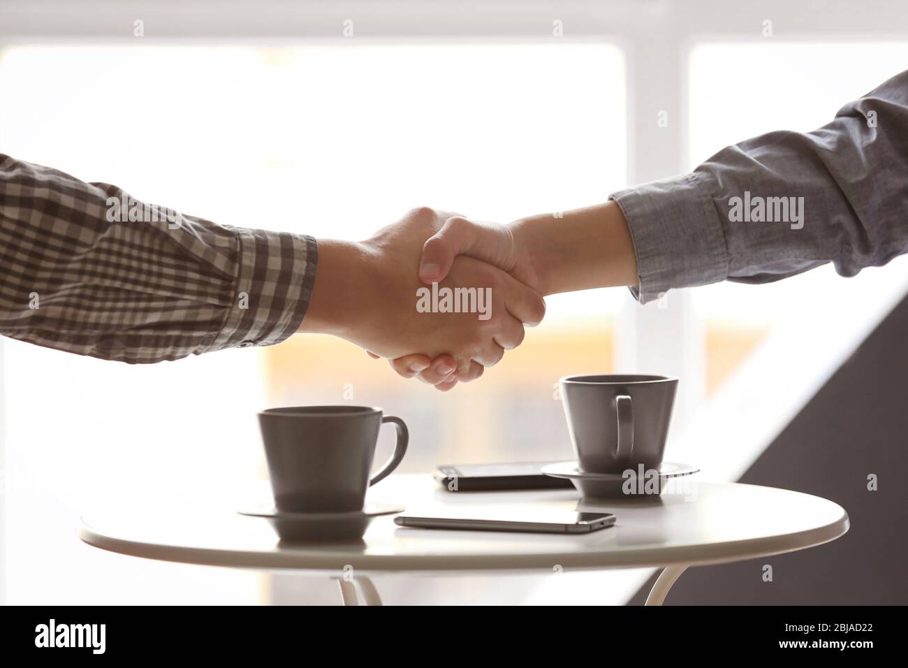 Business people handshaking Stock Photo - Alamy
