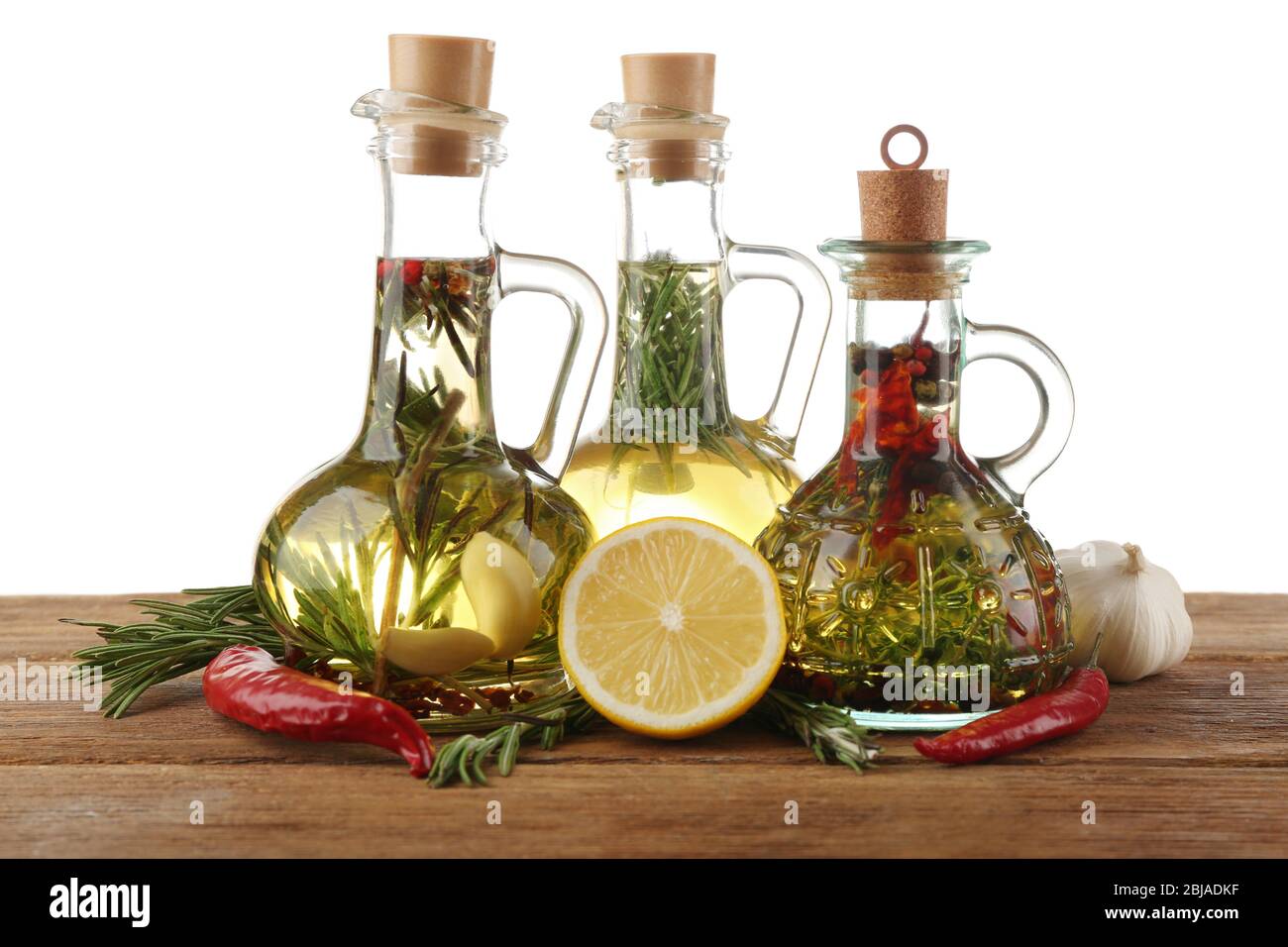 Olive oil with spices, isolated on white Stock Photo - Alamy
